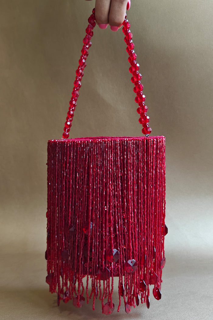 Red glamorous embellished potli with swaying tassels - Plode | Mrs. G