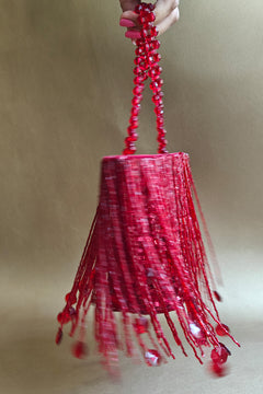 Red glamorous embellished potli with swaying tassels - Plode | Mrs. G