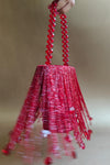 Red glamorous embellished potli with swaying tassels - Plode | Mrs. G